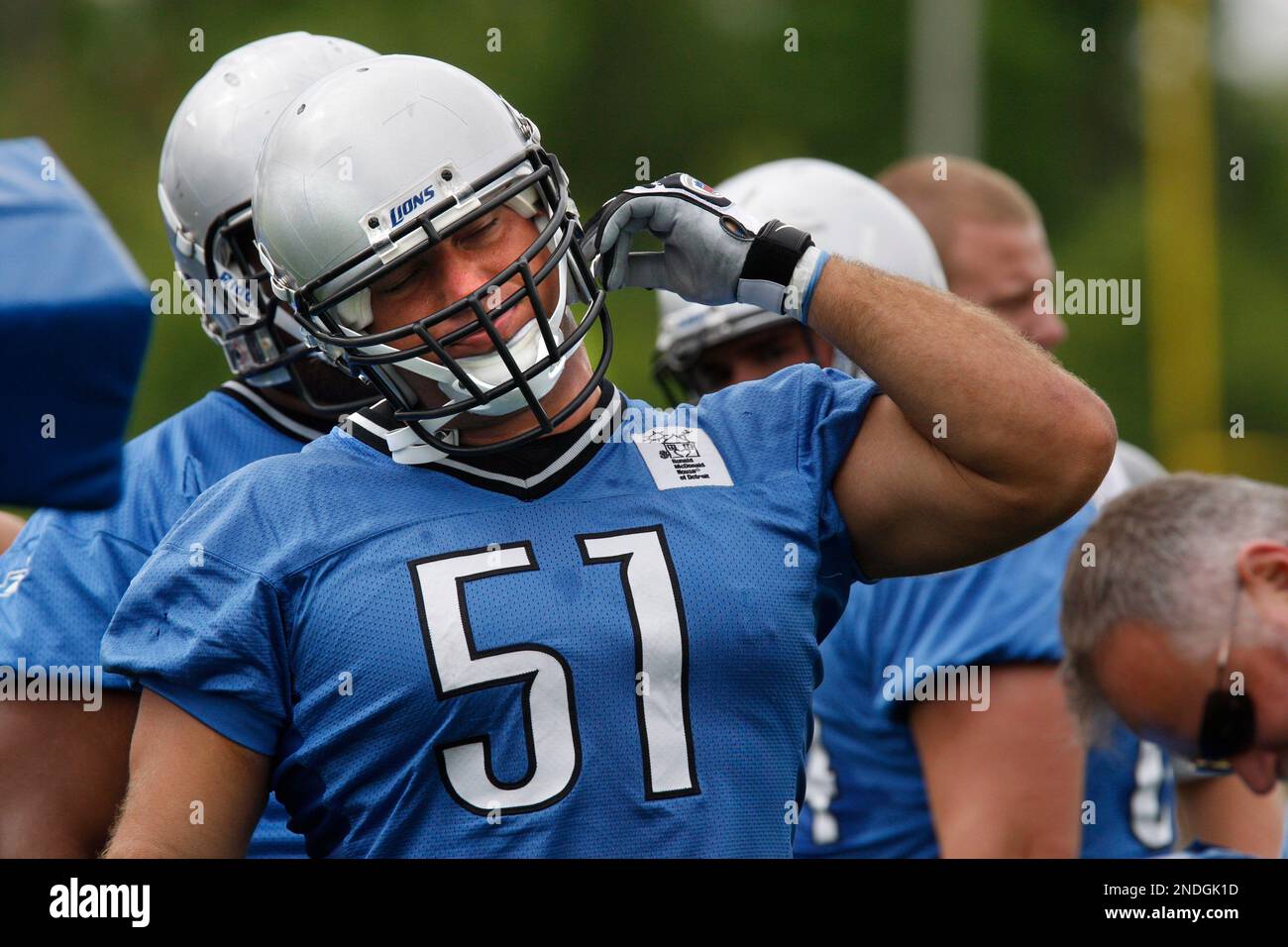 Detroit Lions Dominic Raiola adjusts his helmet during NFL football ...