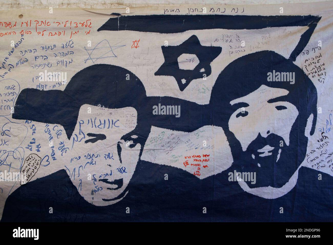 Signatures of supporters and messages of support are seen on a poster ...