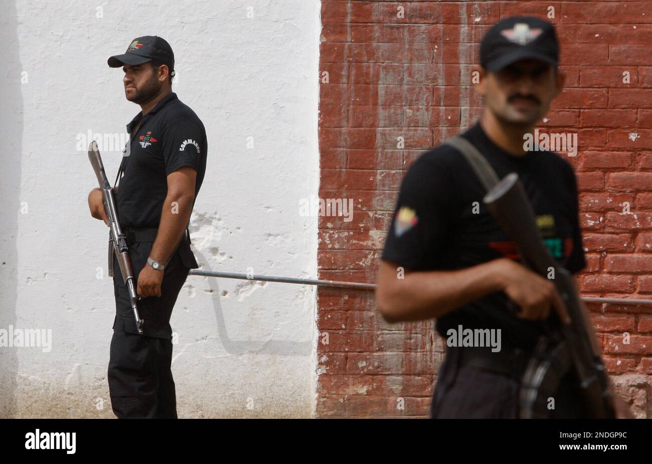 Pakistani police officers stand guard outside the district jail where ...