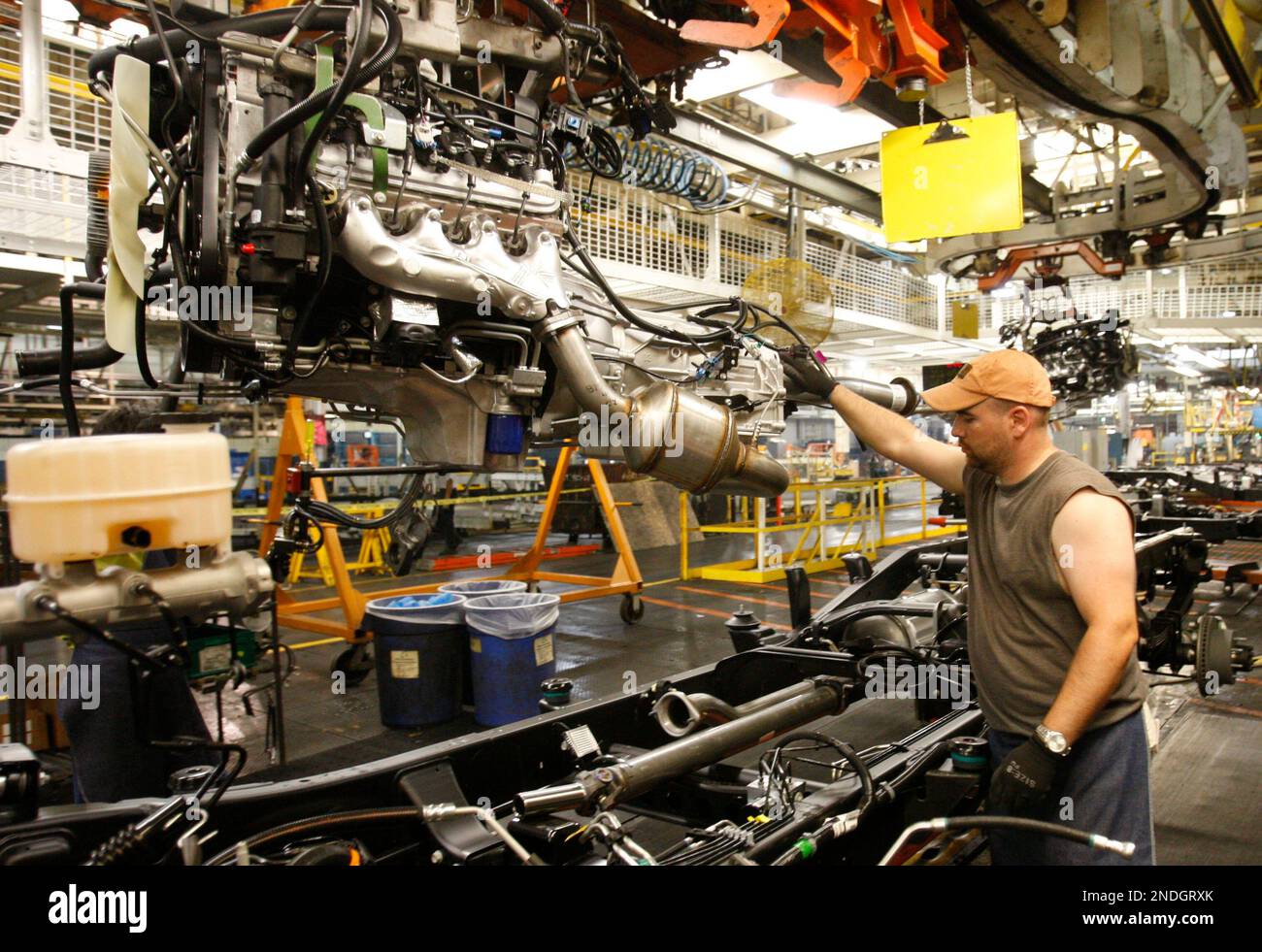 Assemblyman Adam Metzger prepares to mount the engine to the chassis on ...