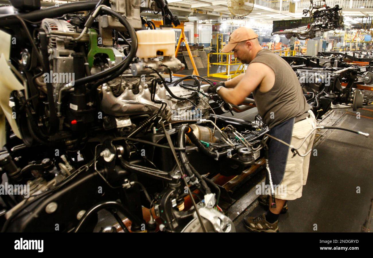 Assemblyman Adam Metzger prepares to mount the engine to the chassis on ...