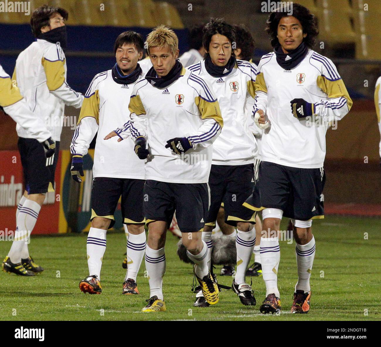 Japan's national soccer team players Keisuke Honda, center, and Daisuke Matsui, center left ...