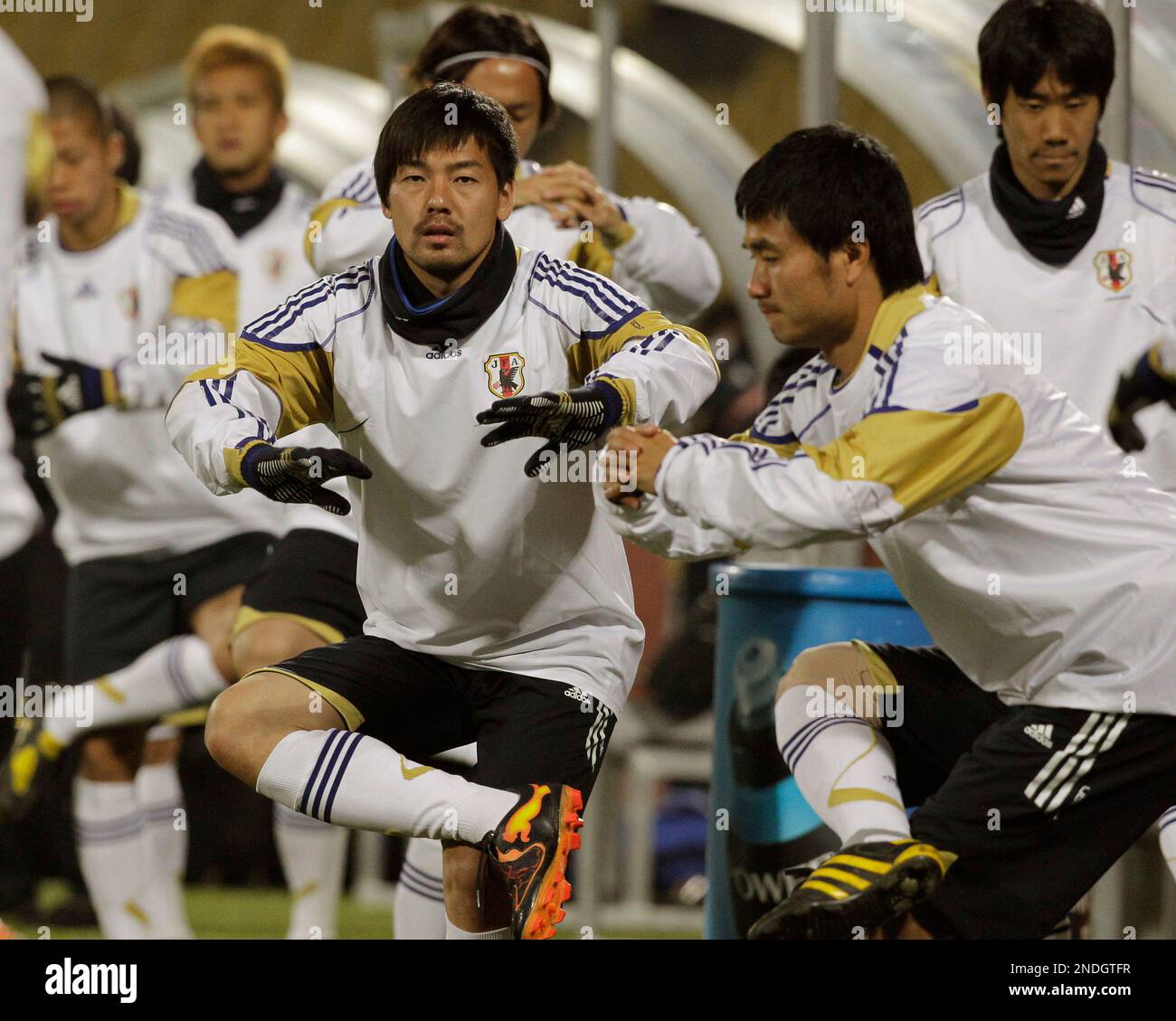 Japan's Daisuke Matsui, center, balances his body during the national team's training session at ...