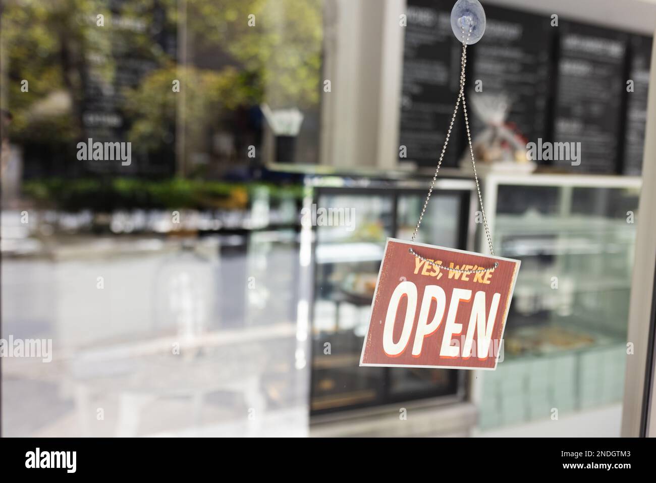Close up of front door of cafe with open sign. Cafe, free time and city ...