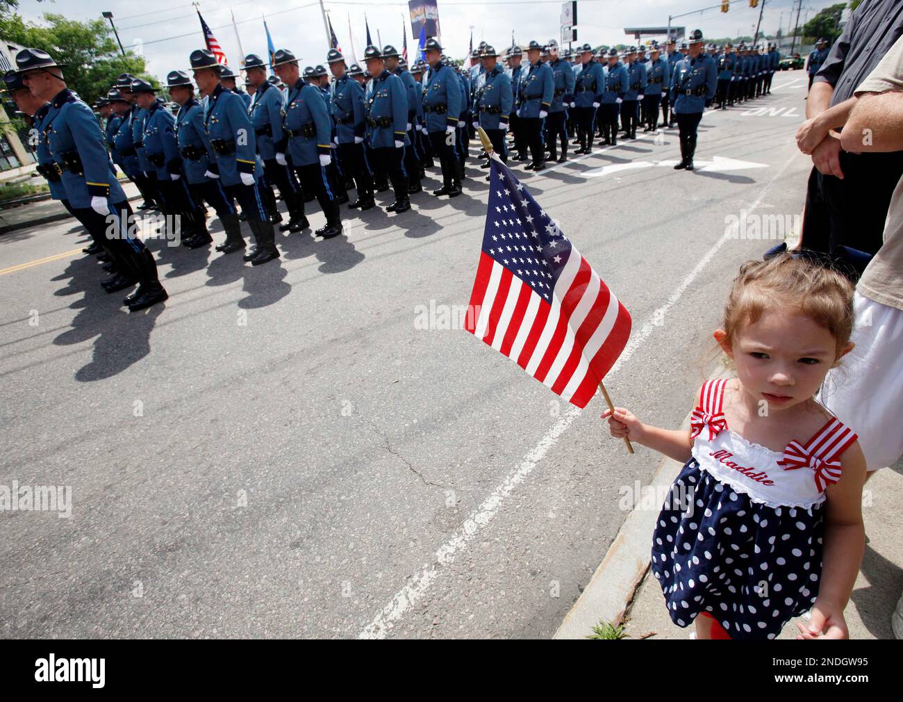 Maddie Rose Gorman, right, of Yorktown Heights, N.Y., holds a flag as ...