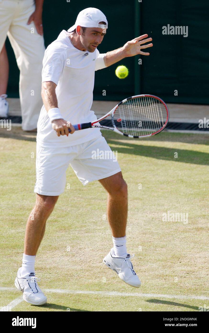 Germany's Benjamin Becker makes a backhand return to Tomas Berdych of ...