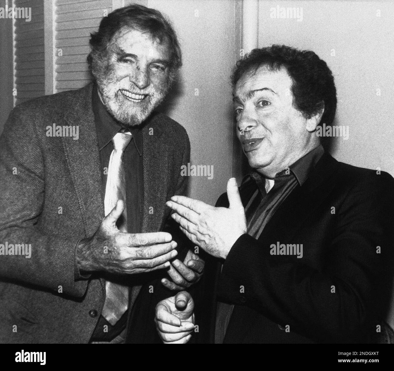 Jackie Mason, right, seems to be giving actor Burt Lancaster a couple ...