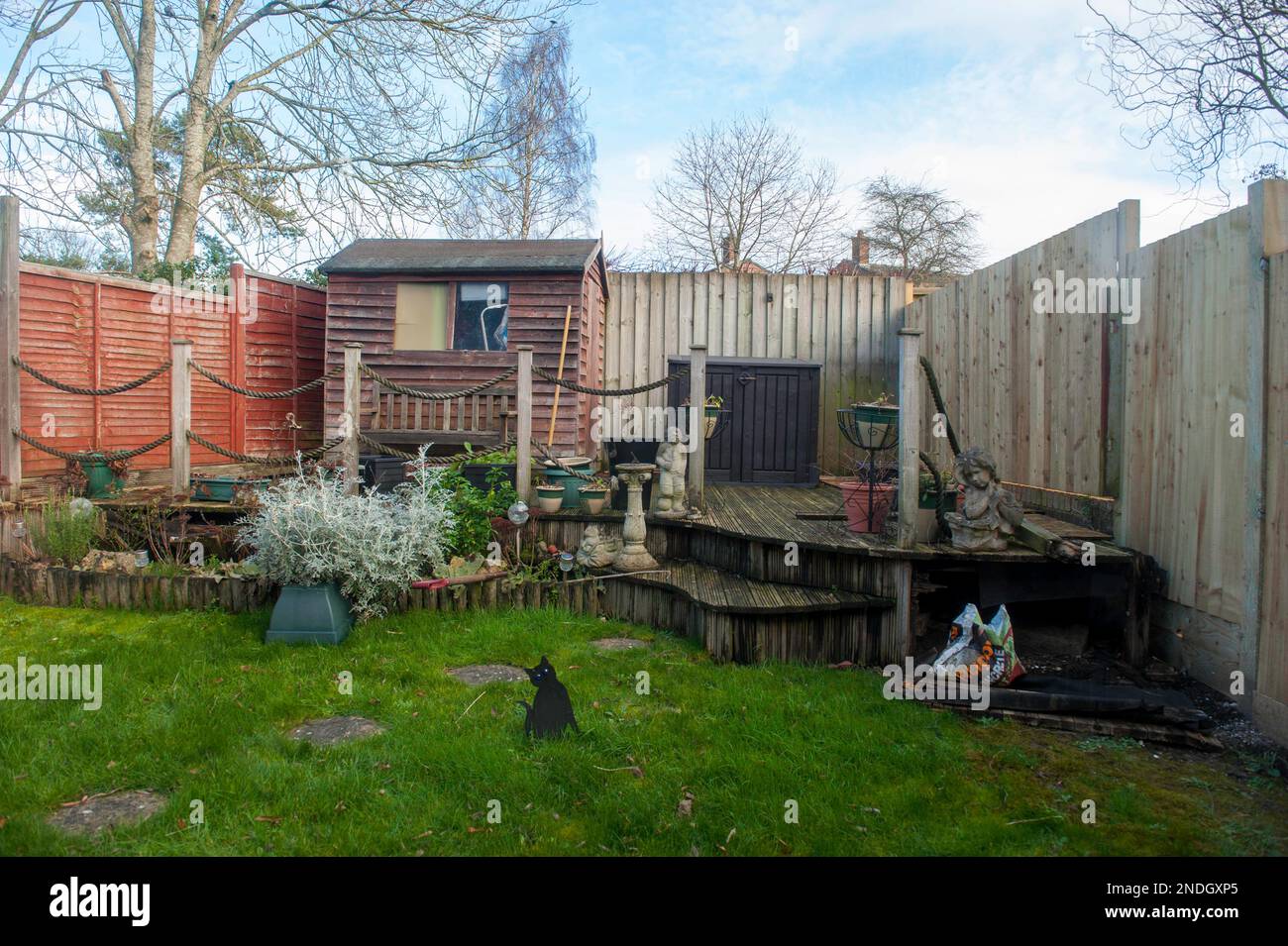 old decking in British garden with shed Stock Photo - Alamy
