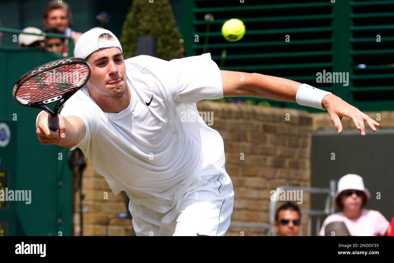 John Isner of the United States makes a forehand return to France's ...