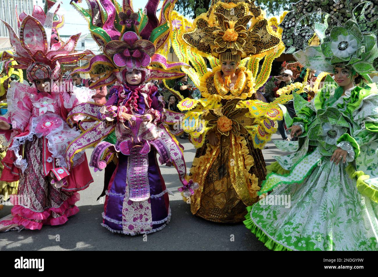 Women wear batik creations during the Solo Batik Carnival, in Solo ...