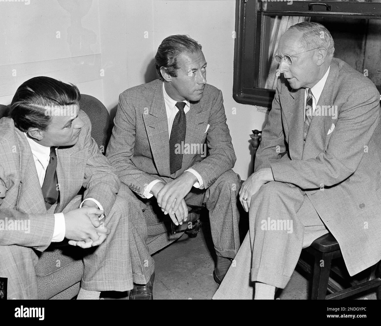 British actor Rex Harrison, left, is questioned by coroner Ben Brown ...
