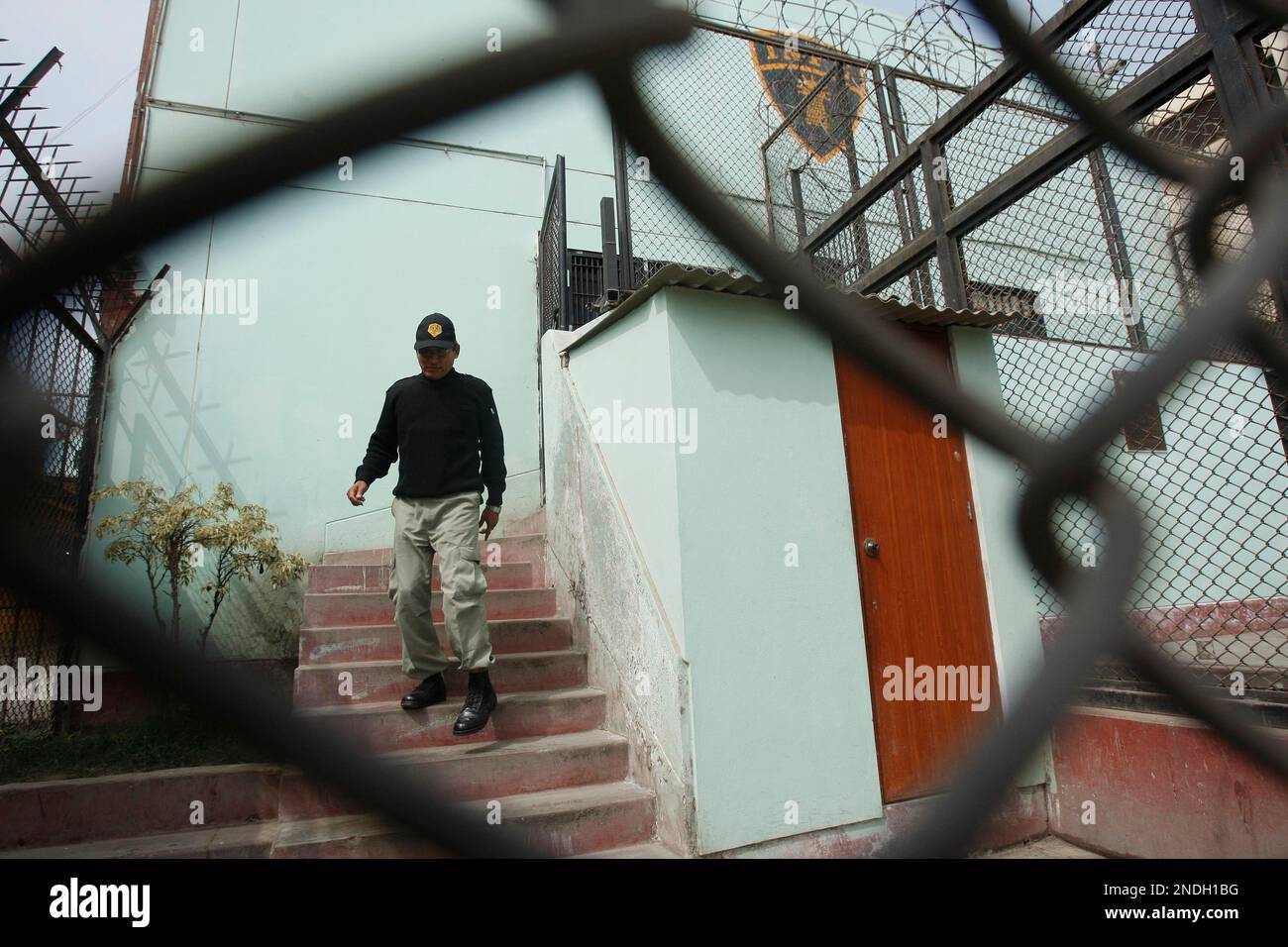 A guard walks on a cell block at the Peruvian prison where Dutch murder ...