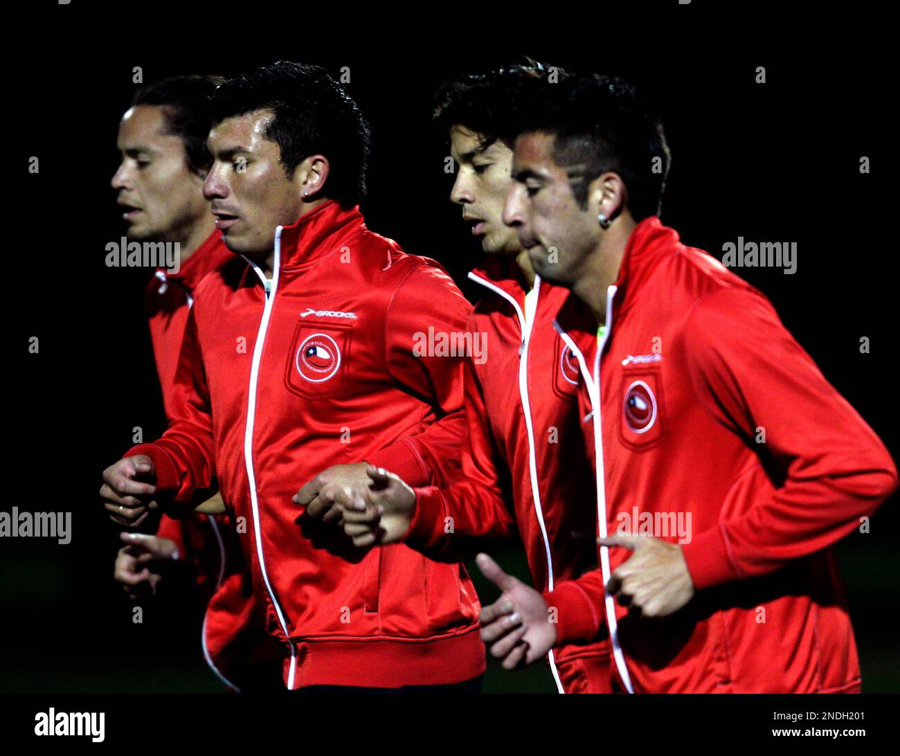 Chile's soccer players run during a team training session at the ...