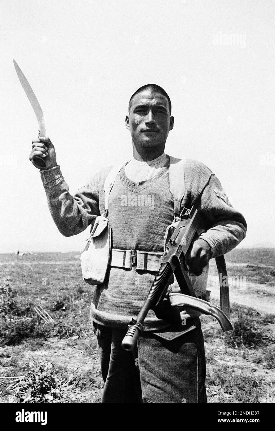 Gurkha with Khurki and U.S. Tommy gun, portrait of Naik Asbir Gurung ...