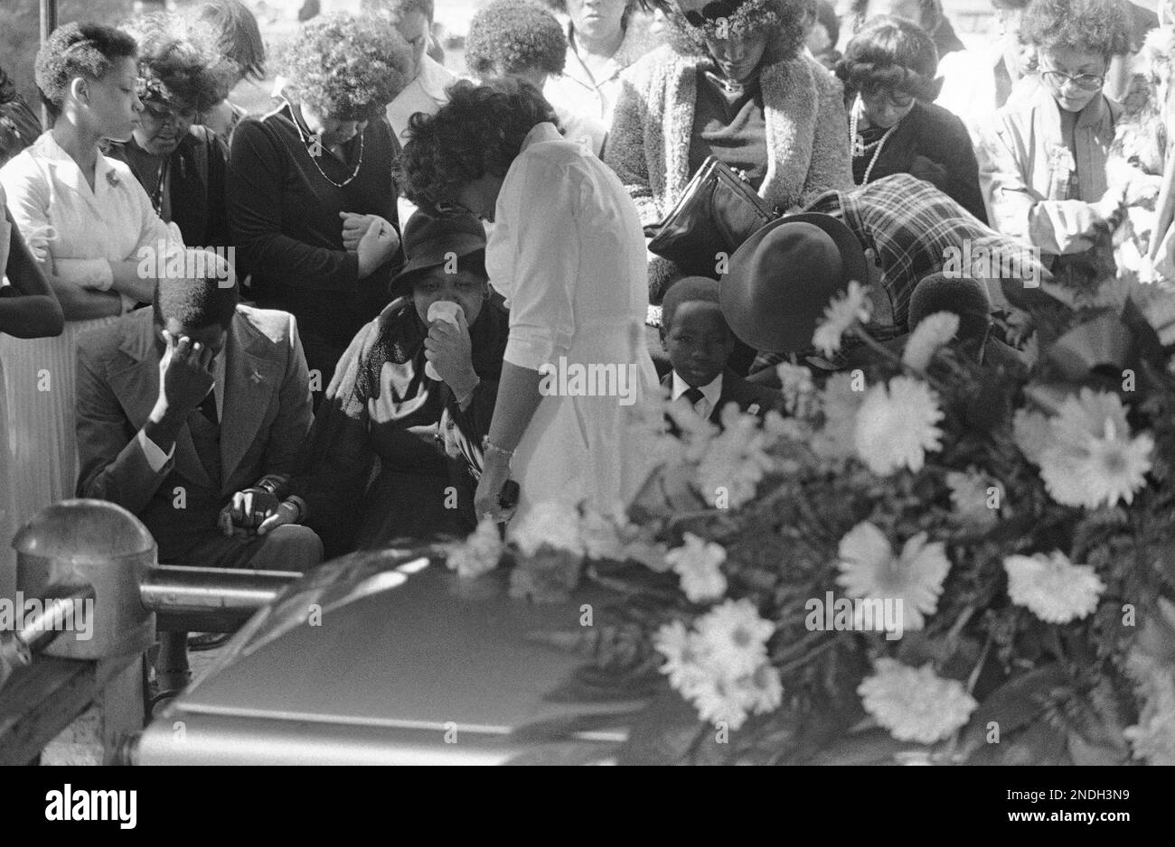 Curtis Walker, Jr., left, holds the hand of his former wife, Ms ...