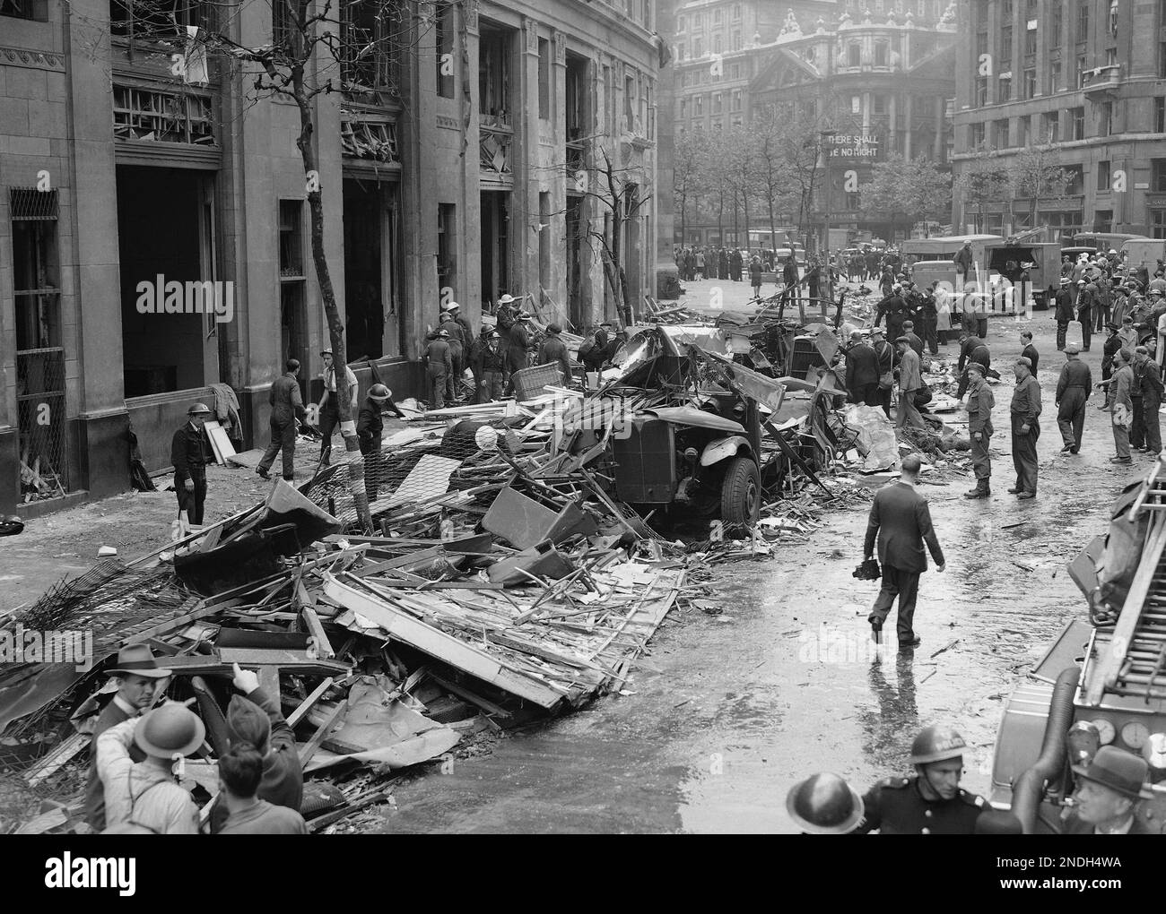 Wreckage of buses and cars and other debris caused by a V1 flying bomb ...