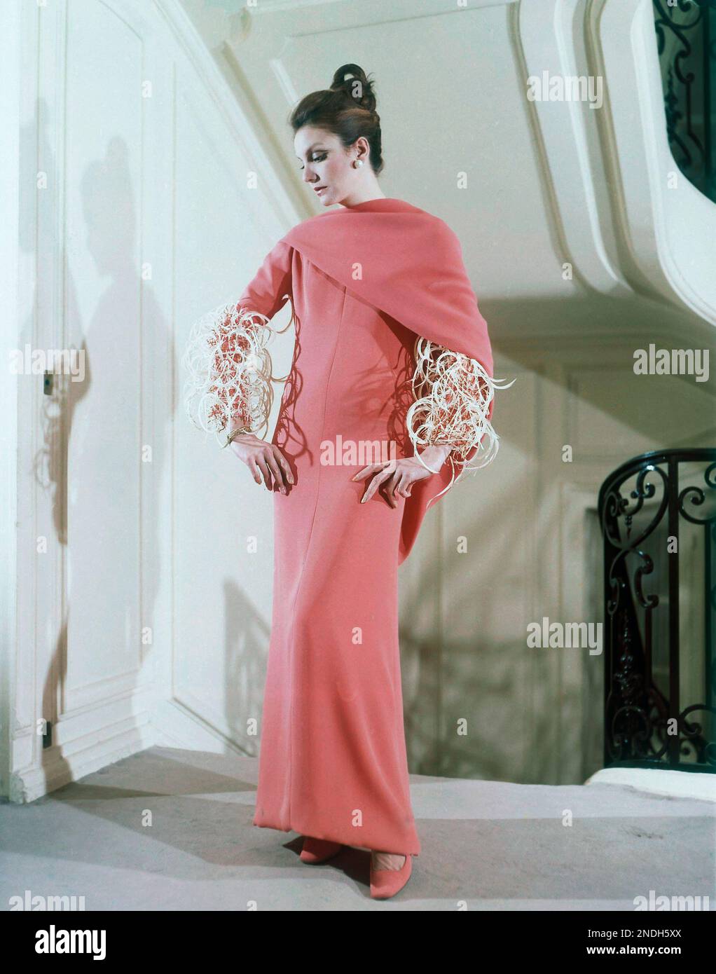 Capucine grape long evening gown with white feathers at the bottom of ...