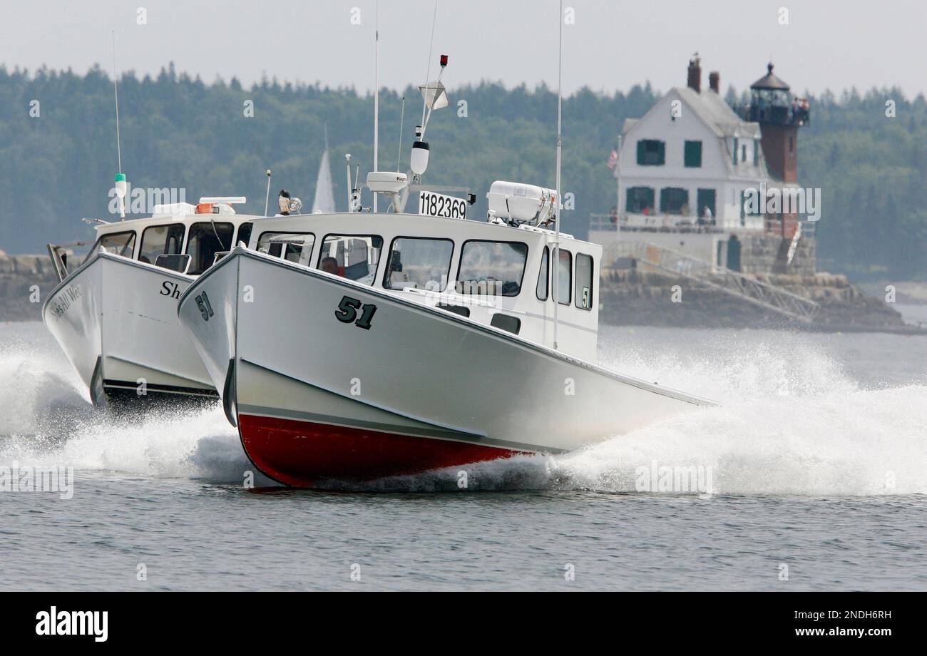 "51," right and "She's All Wet," left, head down the race course during ...
