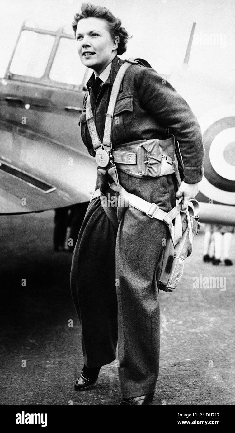A youthful flight mechanic of the Womens Auxiliary Air Force adjusts ...
