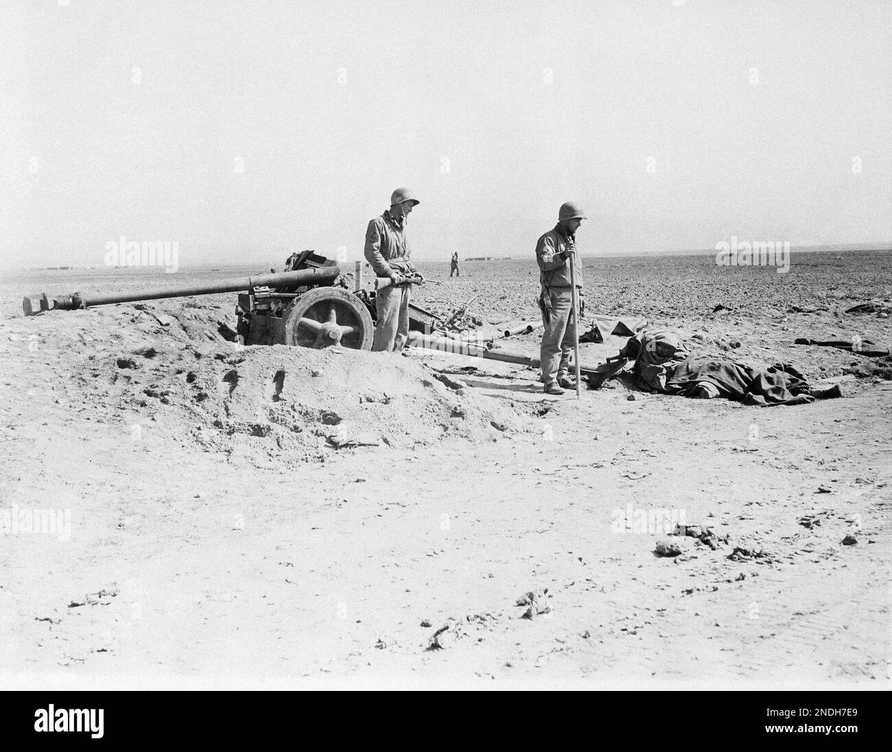 American officers look over an Italian 77-mm. high velocity gun, a new ...