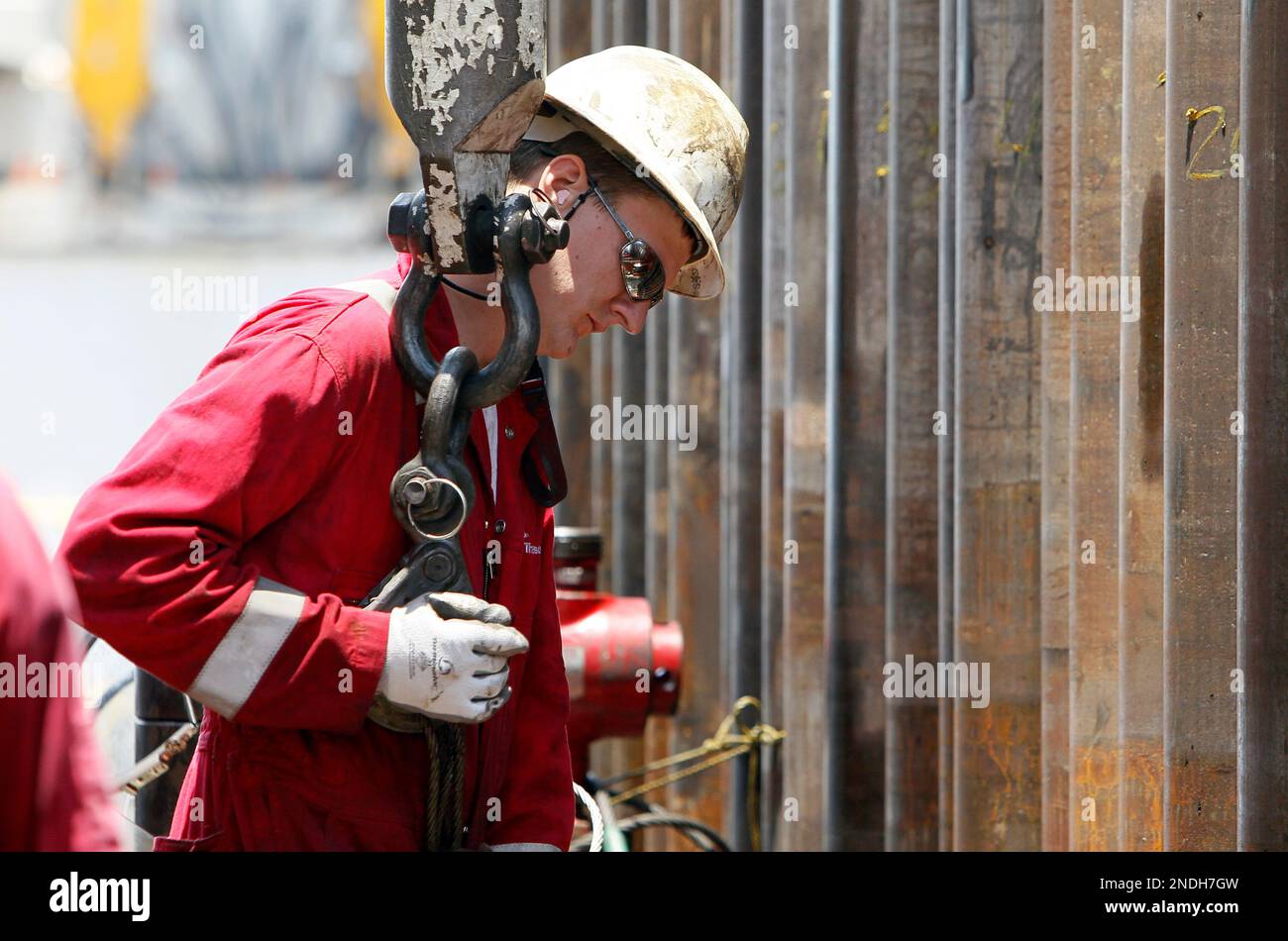 A worker is seen near oil casing pipes on the Development Driller II ...