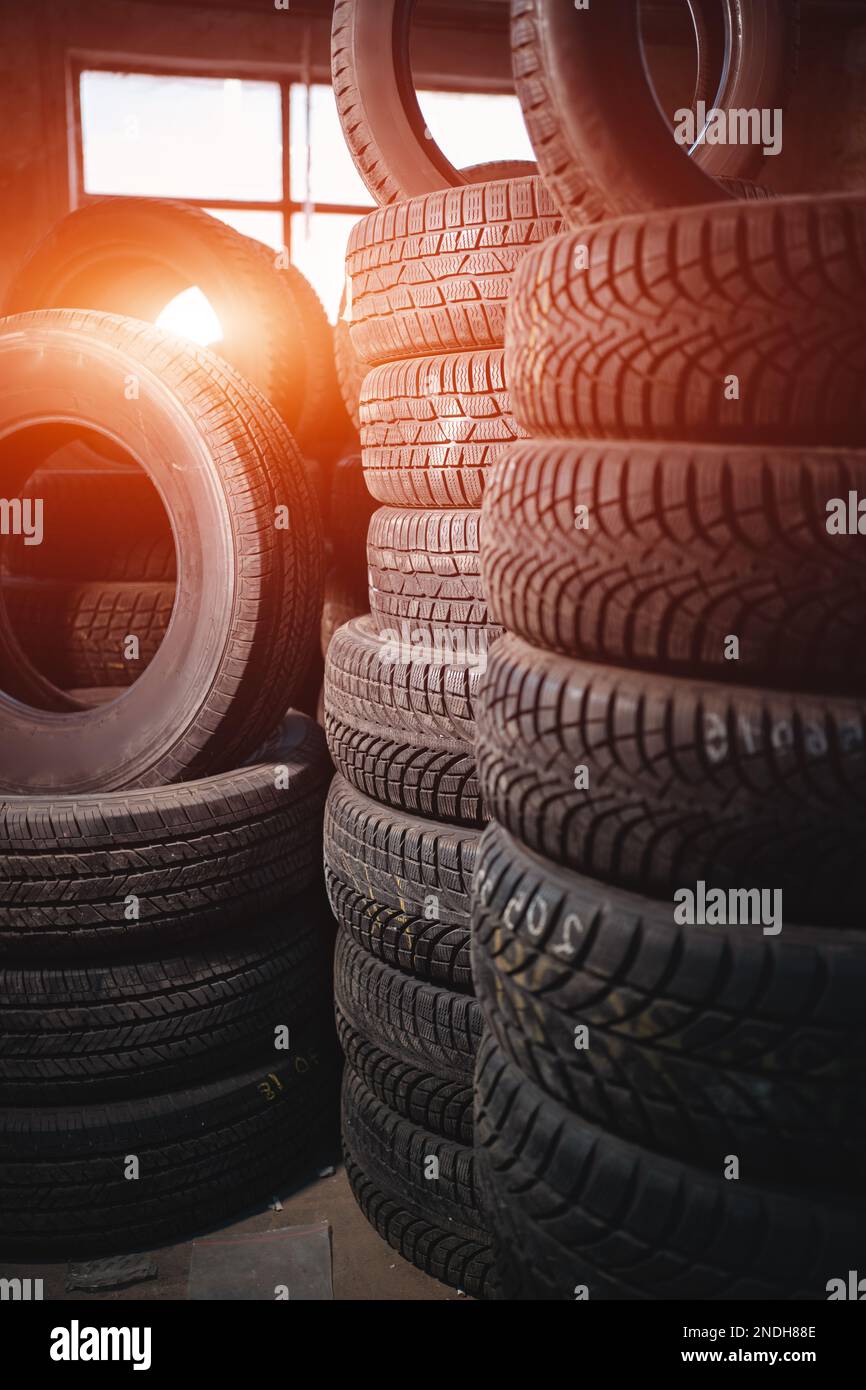 stack of car wheel tires at modern warehouse Stock Photo - Alamy