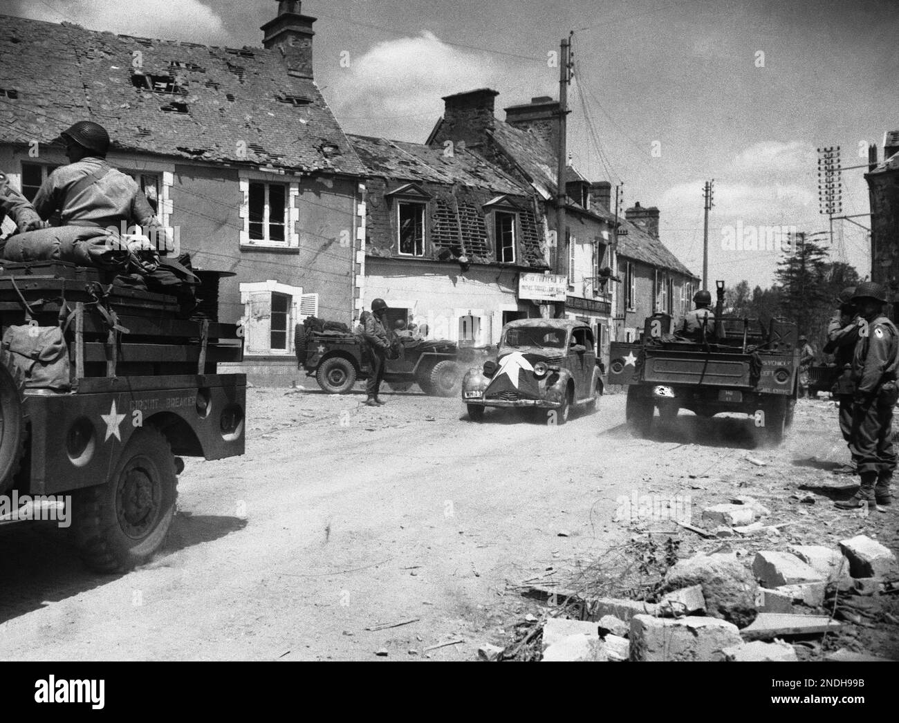 A street scene in St. Saveur, Canada on June 19, 1944 as tanks and ...