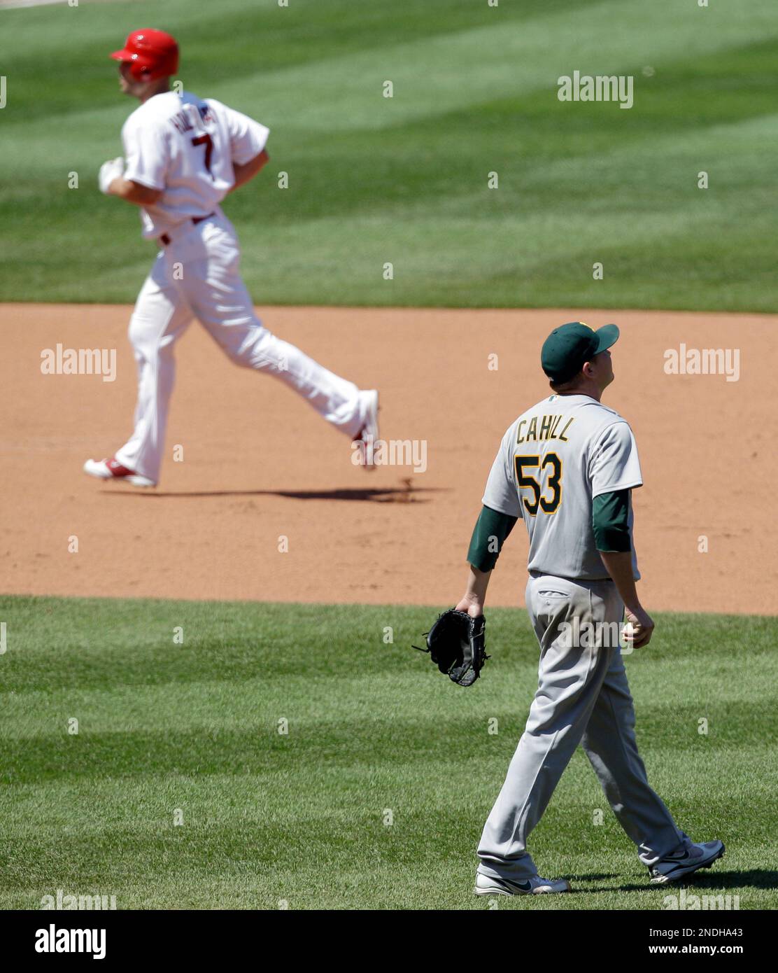 St. Louis Cardinals' Matt Holliday, left, rounds the bases after ...