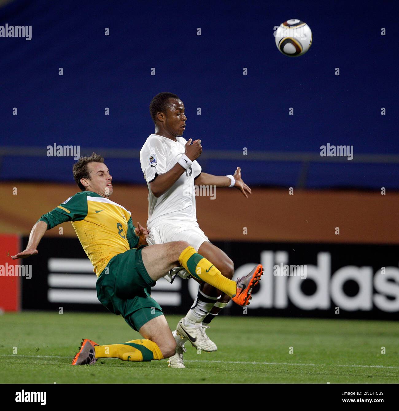 Ghana's Jonathan Mensah and Australia's Vince Grella during the World ...