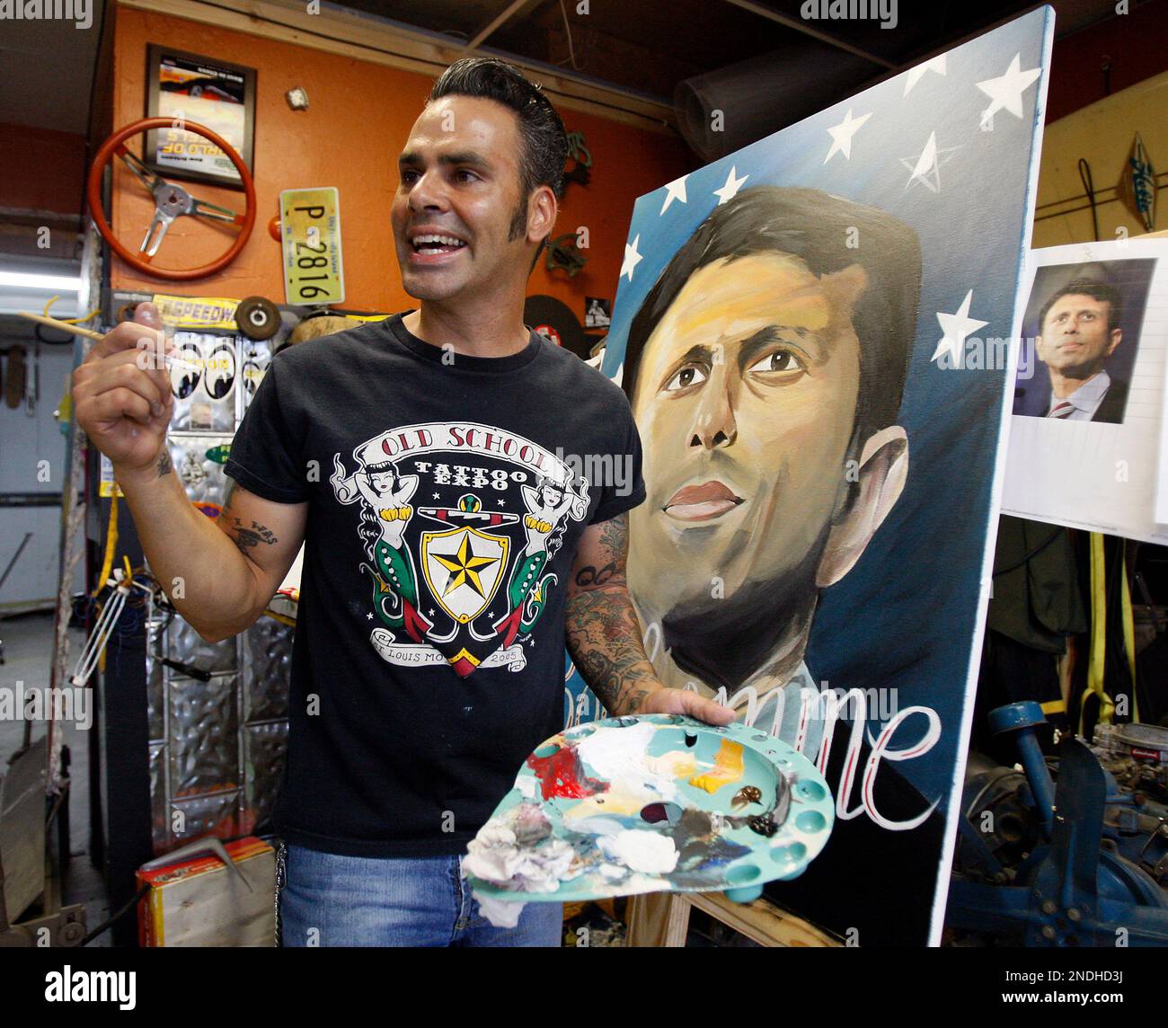 Bobby Pitre laughs while painting a portrait of Louisiana Gov. Bobby ...