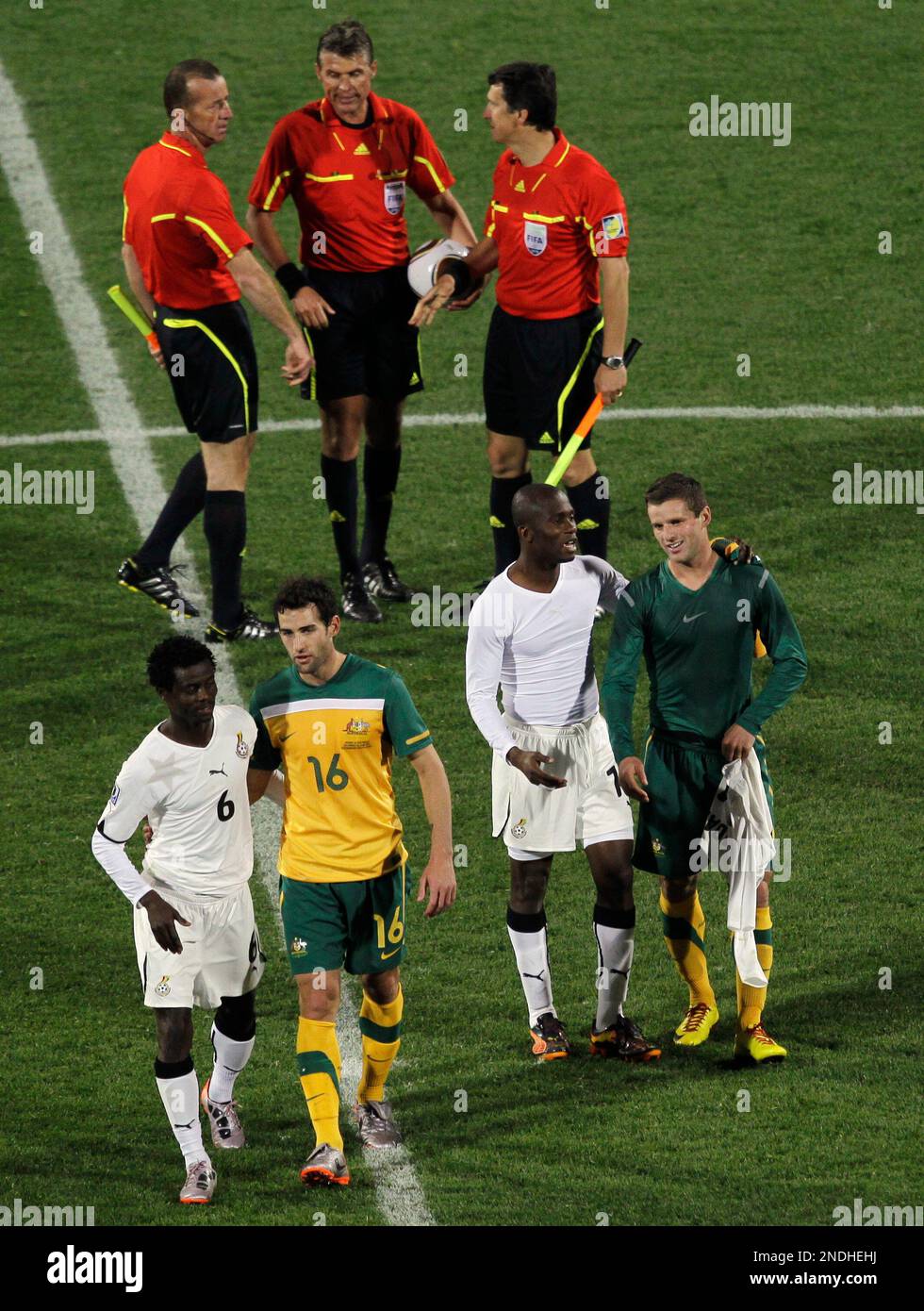 From left in the foreground; Ghana's Anthony Annan, Australia's Carl ...