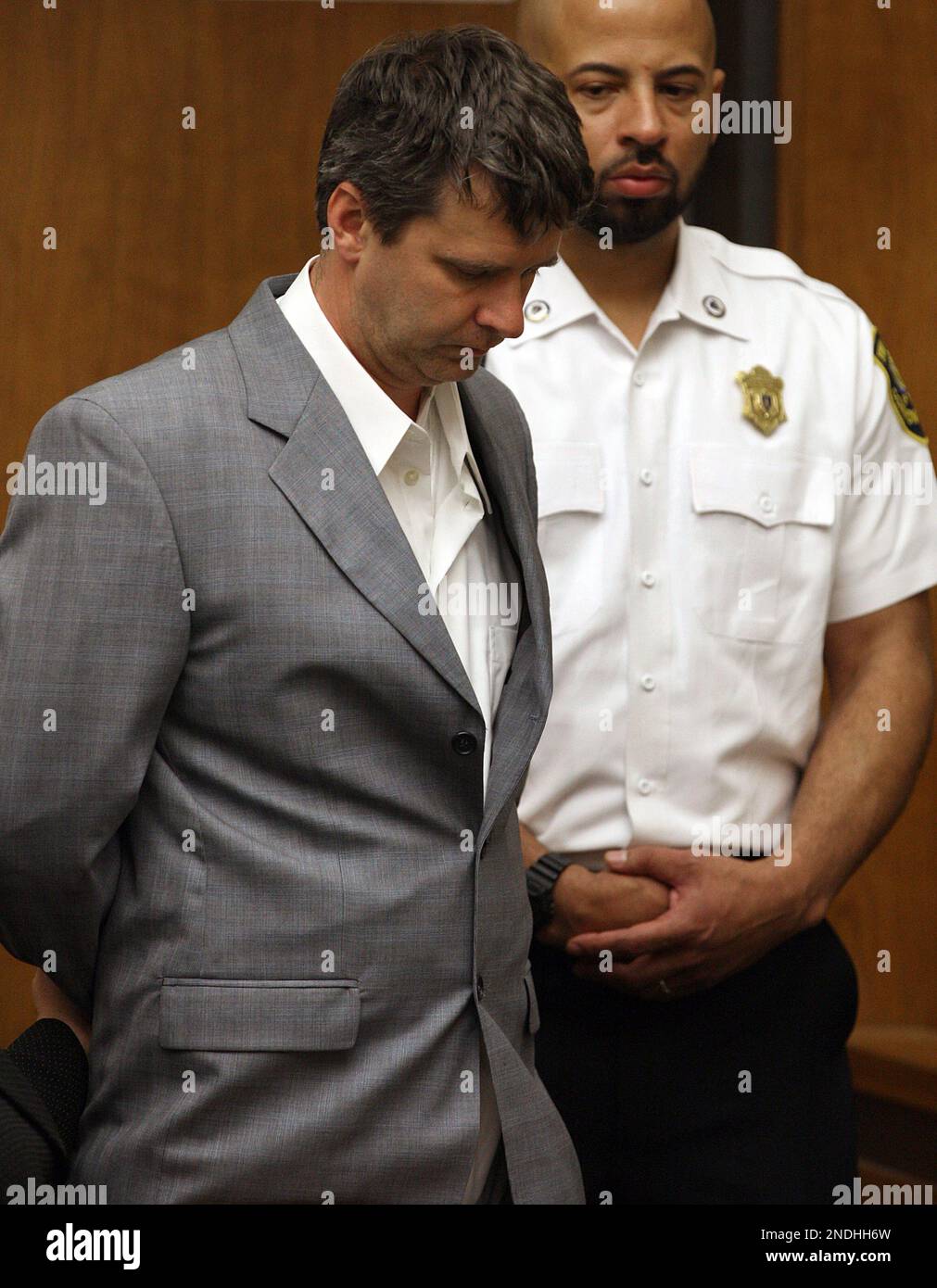 Thomas Mortimer IV stands for his arraignment at Middlesex Court ...