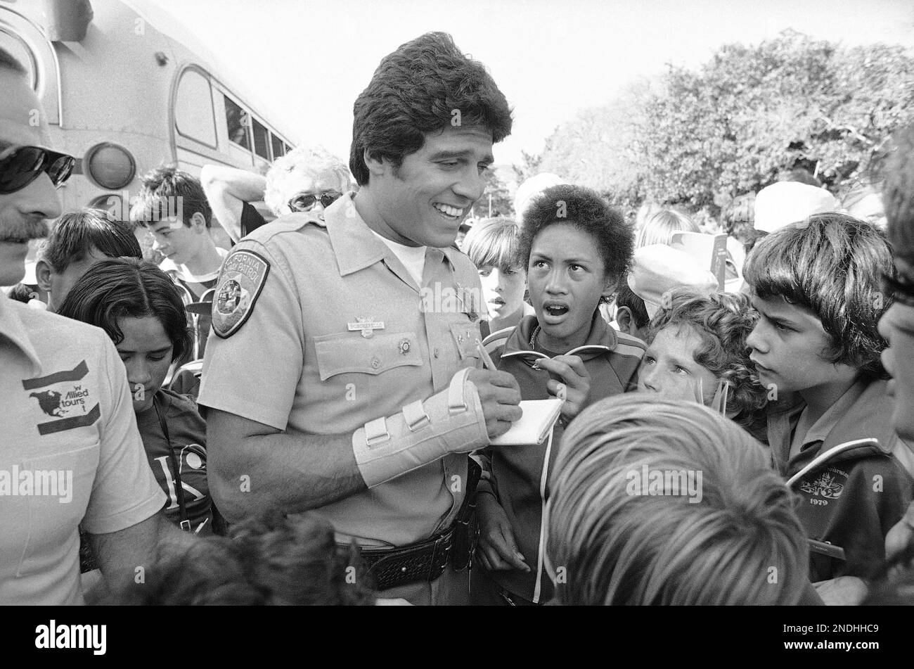 Group of children from New Zealand crowd around Chips television series ...