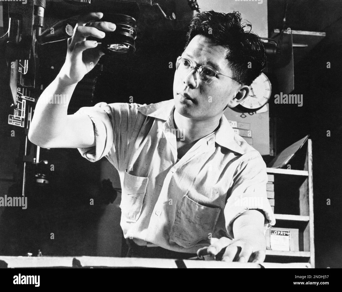 Boyish – looking Richard Sakamoto is shown at work in a photographic ...