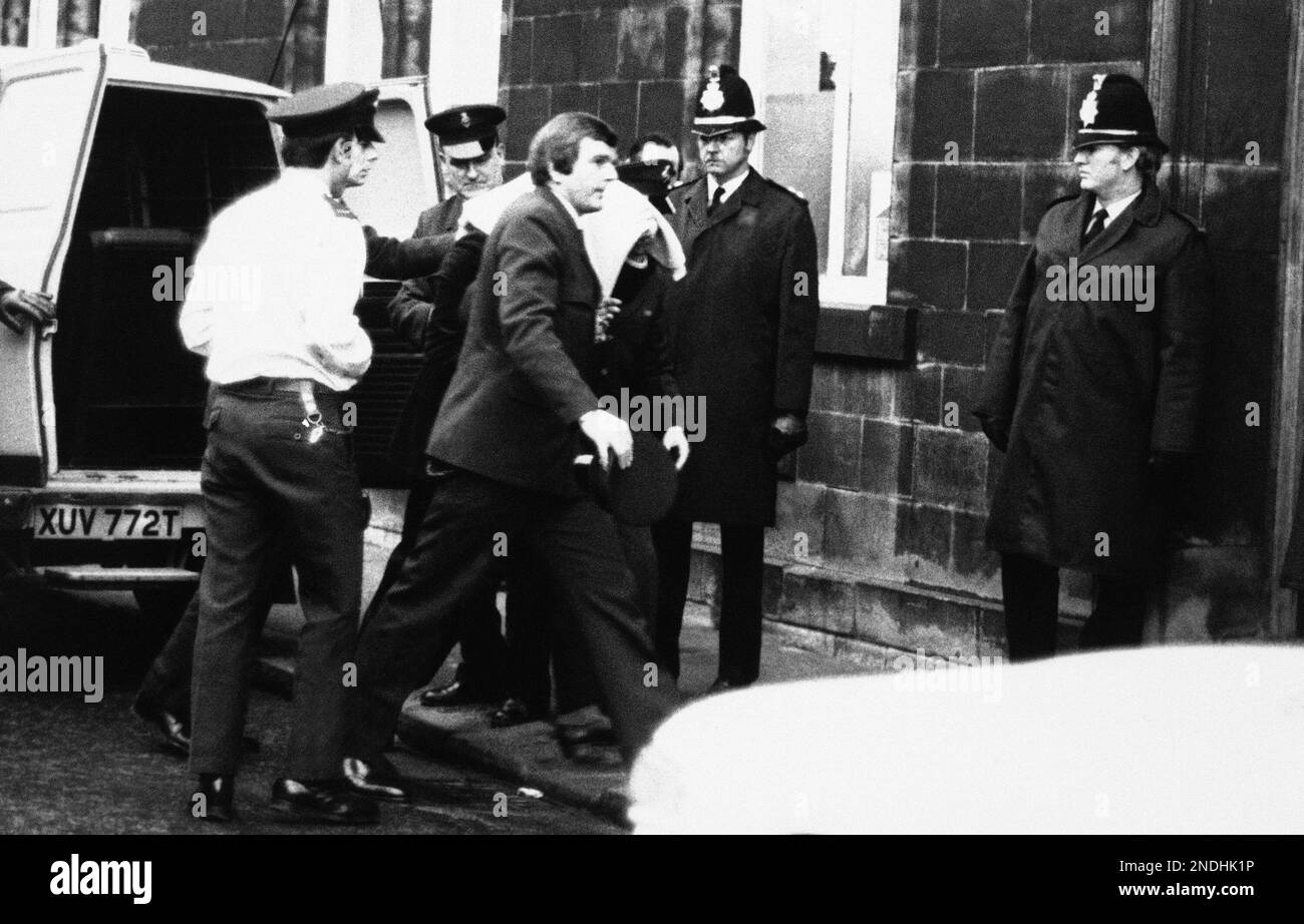 Bradford lorry driver Peter William Sutcliffe (blanket on head) in ...