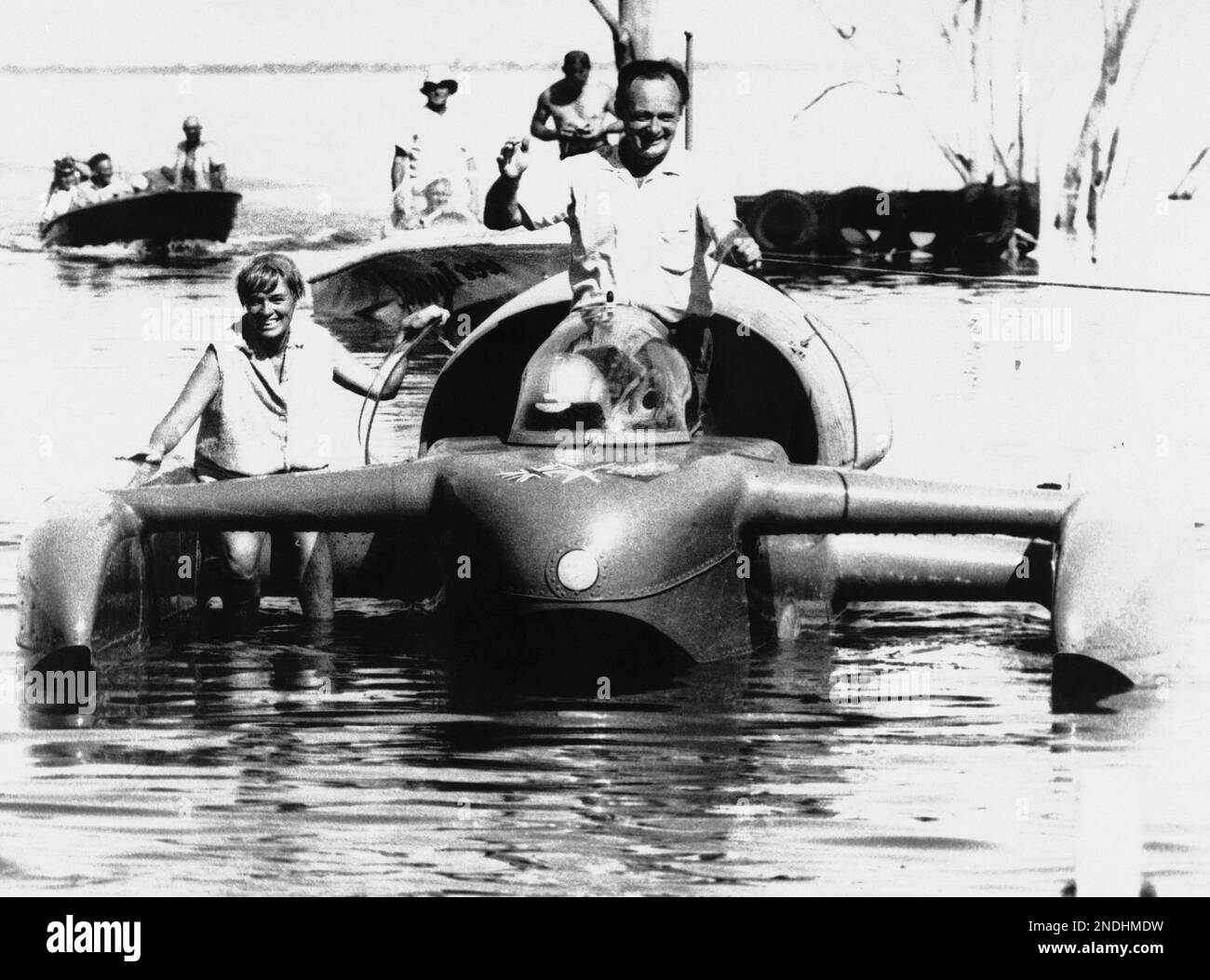 Donald Campbell waves to cheering onlookers with his wife Tonia Bern ...