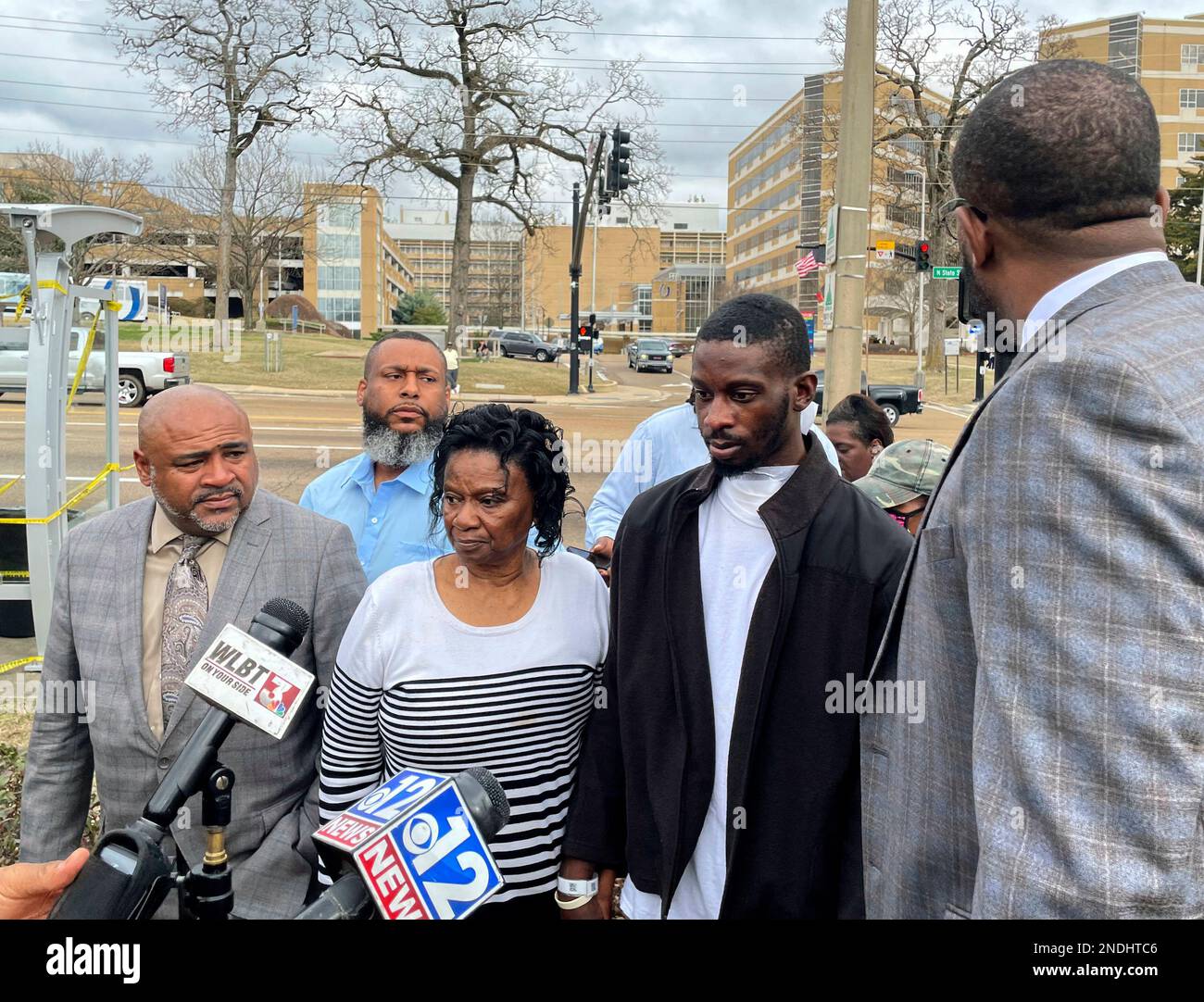 Michael Jenkins, second from right, stand with his mother, Mary Jenkins ...