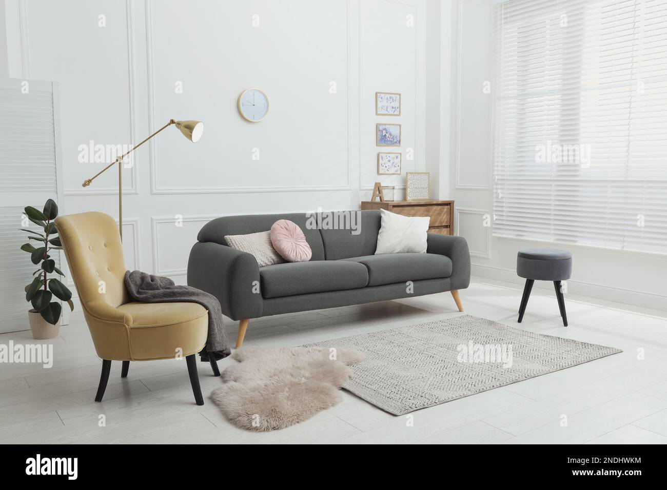 Comfortable sofa in modern living room. Interior design Stock Photo - Alamy