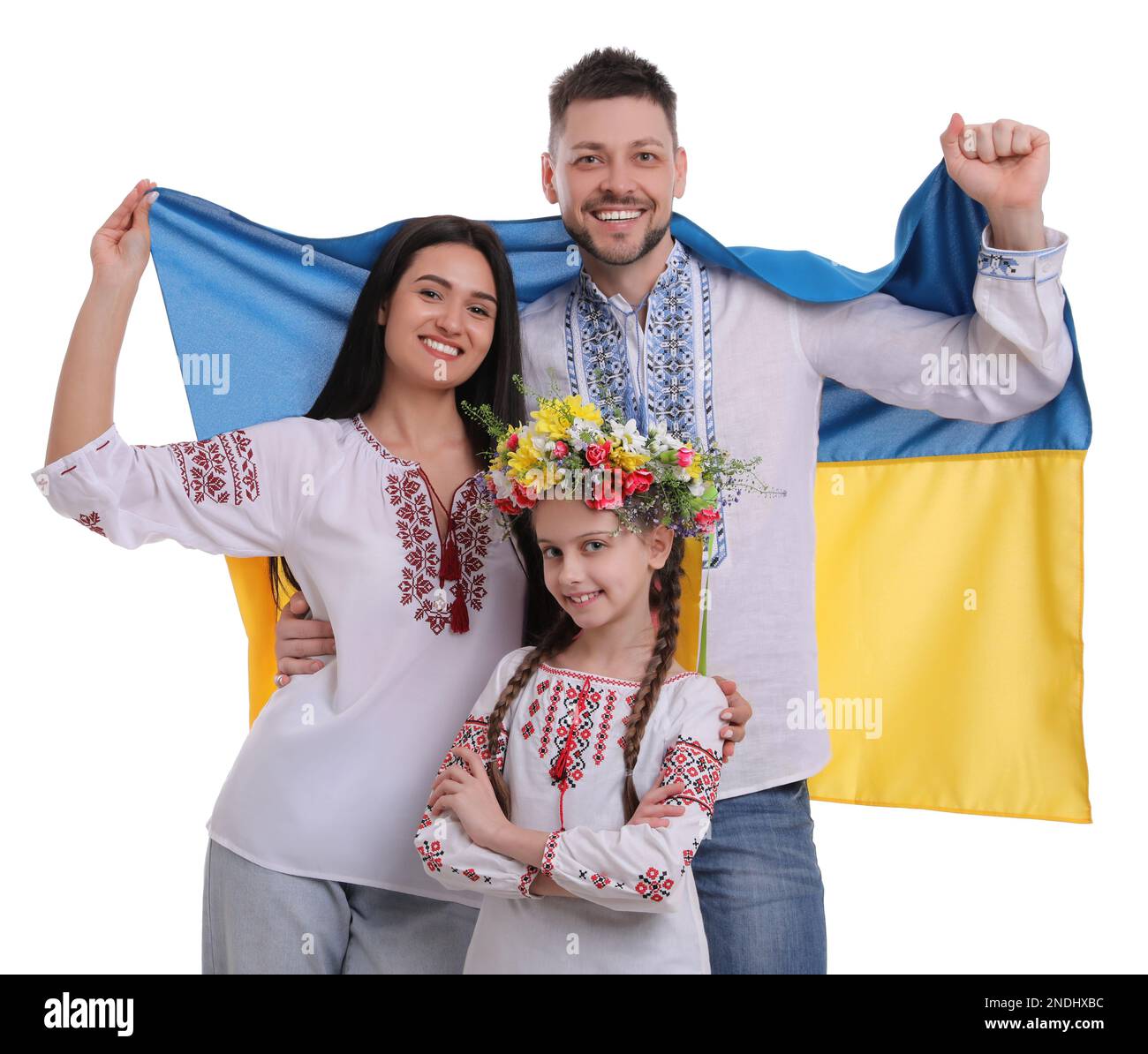 Happy family in national clothes with flag of Ukraine on white ...