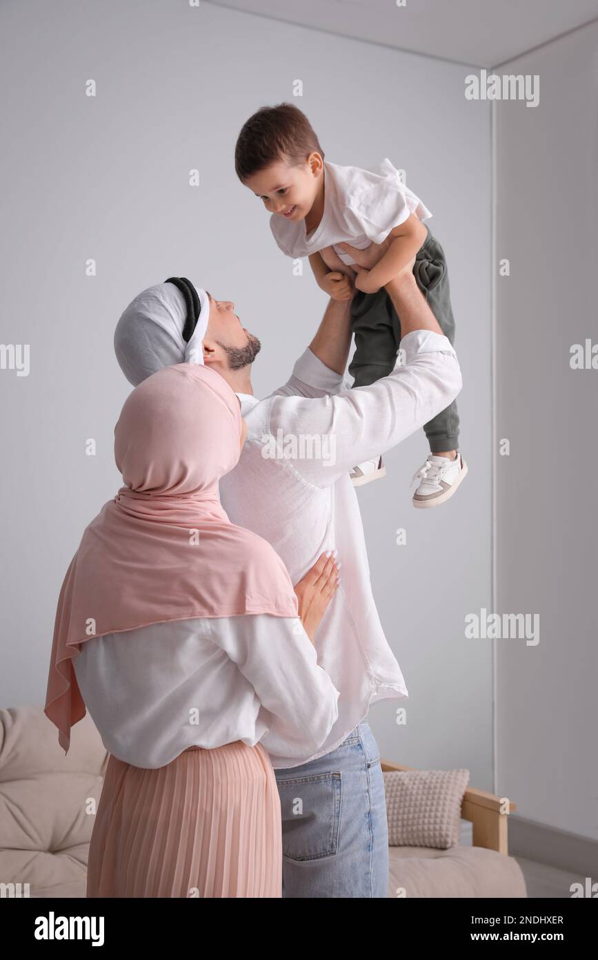 Happy Muslim family spending time together at home Stock Photo - Alamy