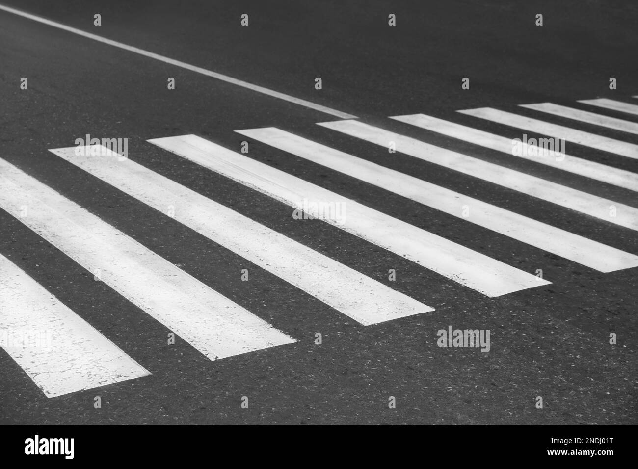 White pedestrian crossing on empty city street Stock Photo - Alamy