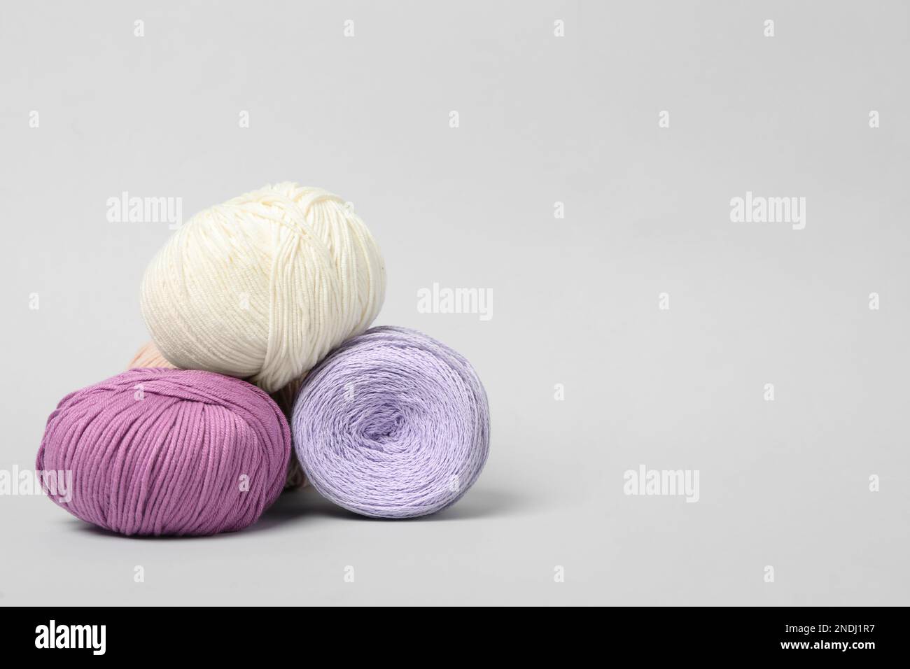 Soft woolen yarns on white background, space for text Stock Photo - Alamy