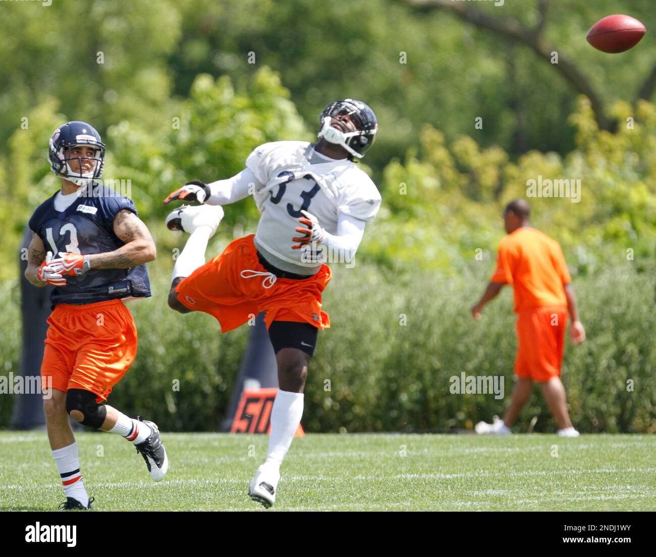 Chicago Bears' Johnny Knox, left, and Charles Tillman miss a catch ...