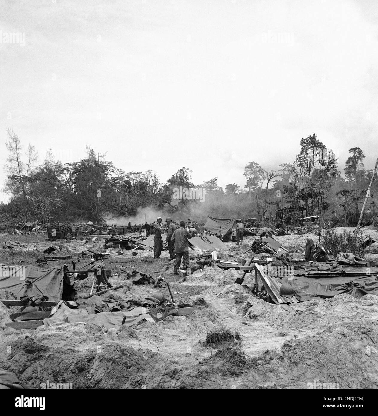 Beach at Lorengau, Manus Island showing members of U.S. 1st cavalry dug ...