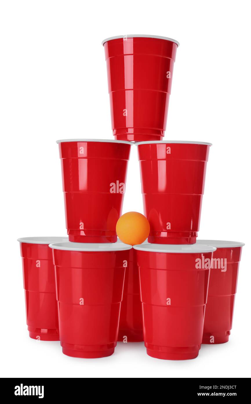 Red plastic cups and ball for beer pong on white background Stock Photo ...