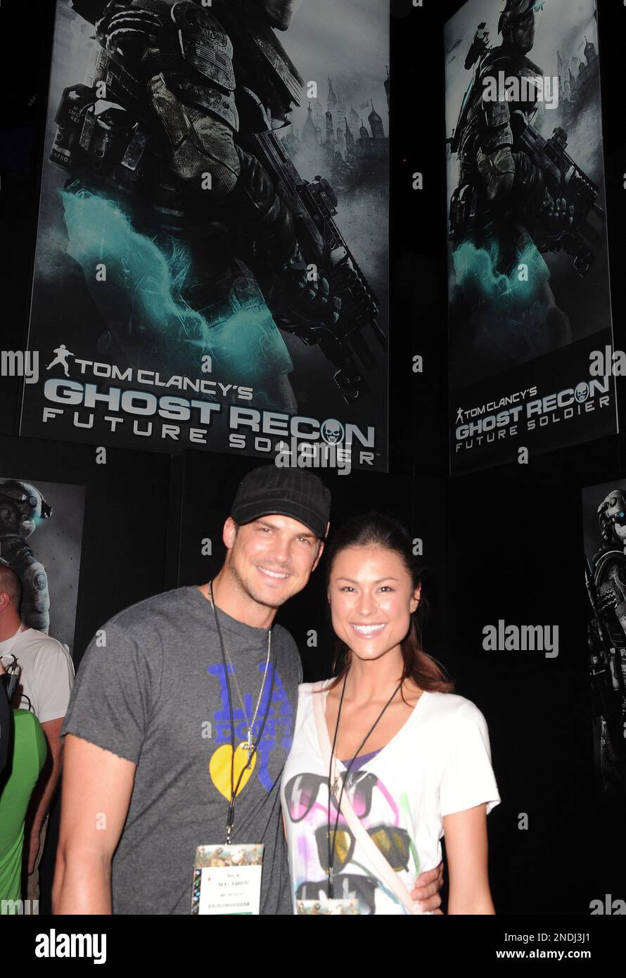 Rick Malambri, left, and Lisa Piepergerdes at the Ubisoft Booth at the ...