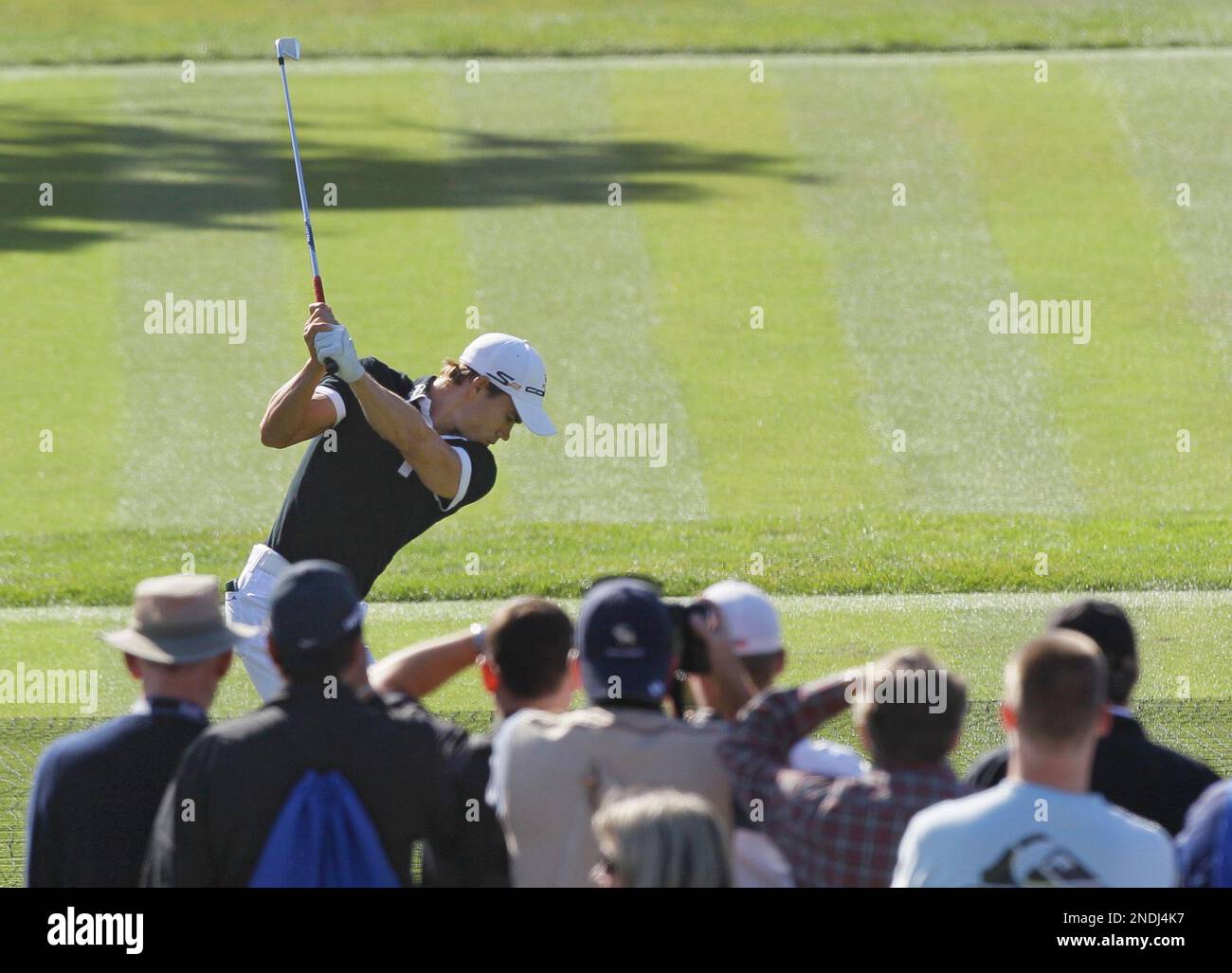 Camilo Villegas of Colombia hits a drive on the fourth hole during a ...