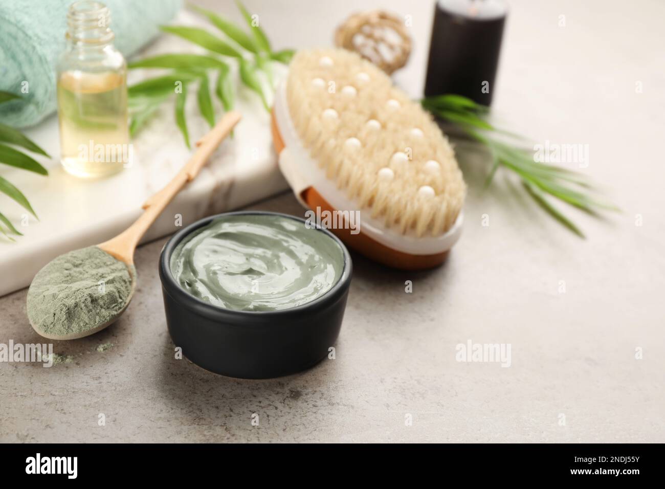 Cosmetic product for spa body wraps on light grey stone background ...