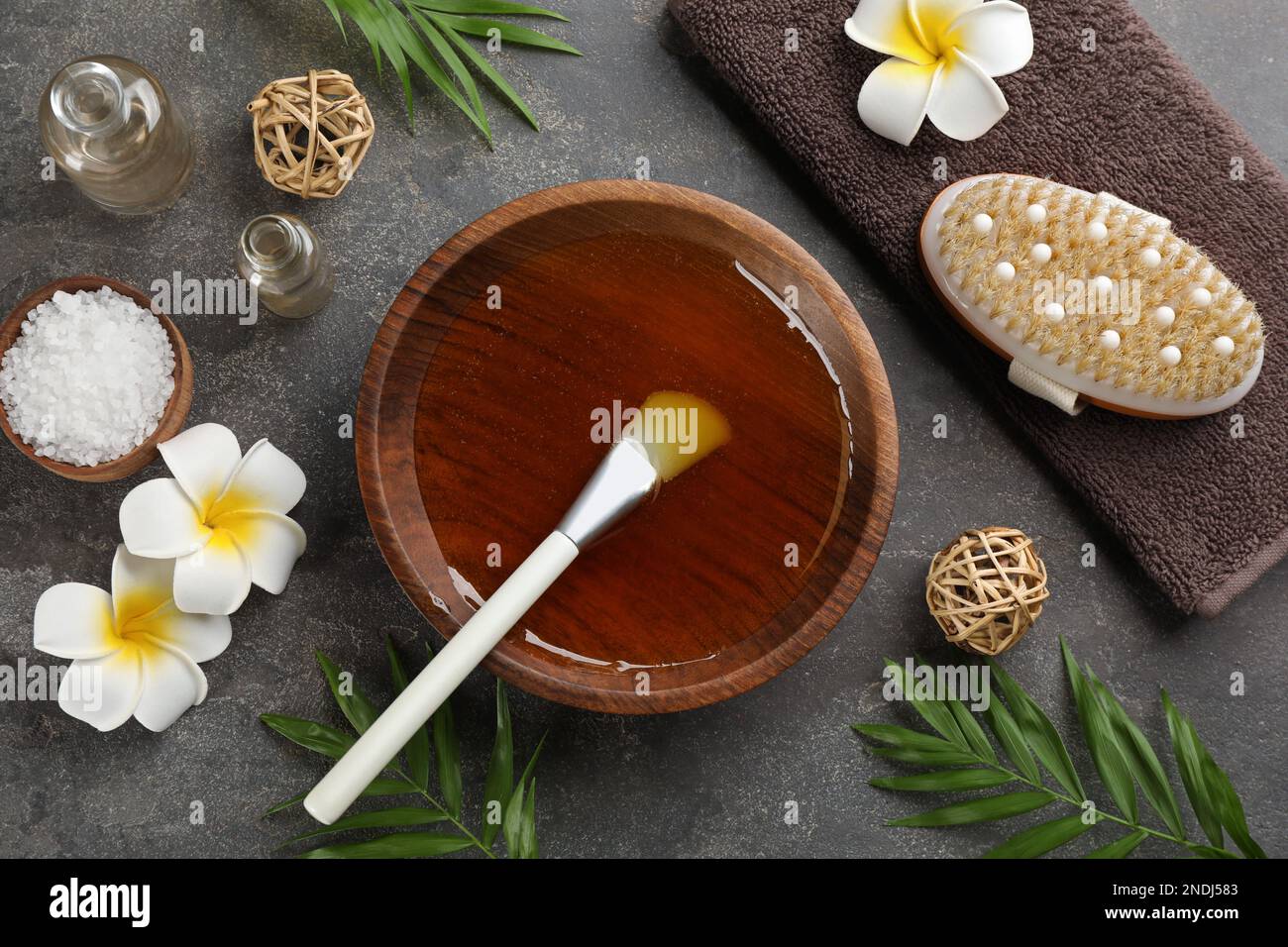 Flat lay composition with cosmetic product for spa body wraps on grey ...