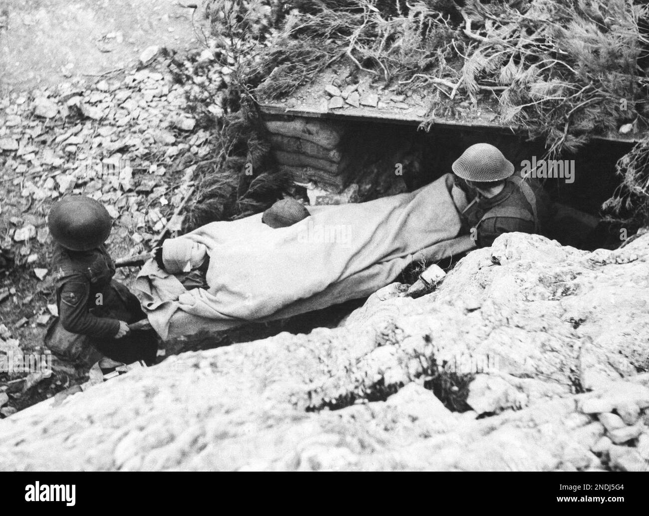 First Aid Men of a Northants Regimental Aid Post at work in a forward ...